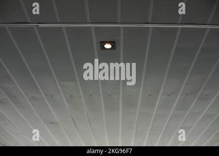 Ceiling of building canopy. White ceiling. Architectural details. Shop ...