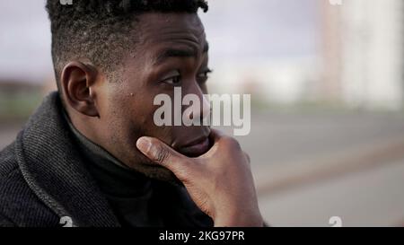 Stressed ou black African man feeling neck pain due to emotional ...