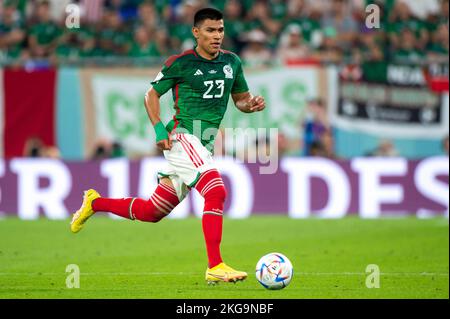 DOHA, QATAR - NOVEMBER 22: Jesus Gallardo of Mexico runs with the ball ...