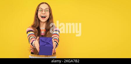 happy child in eyeglasses giving present box for holiday, purchase ...