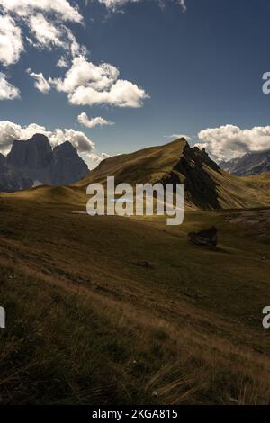A vertical shot of scenic Dolomite Mountains in Italy covered with ...