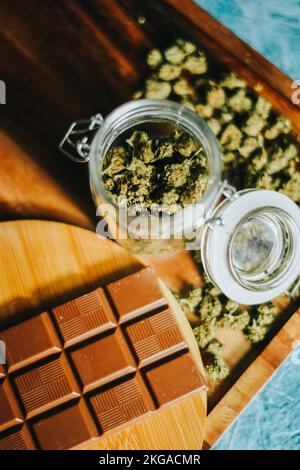 Marijuana butter on wooden table coffee gingerbread and green color ...