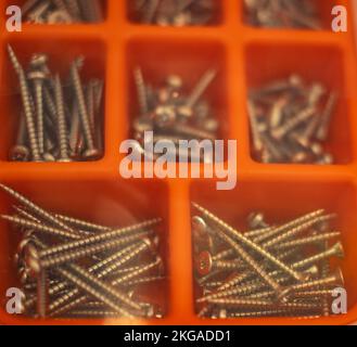 many screws in plastic organizer box top view Stock Photo - Alamy