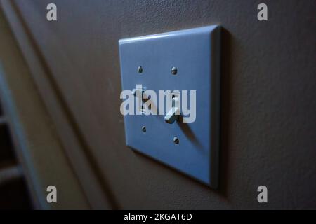Light switch downstairs one on one off Stock Photo - Alamy