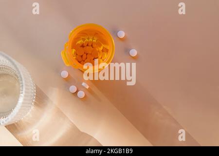 Pills in plastic orange bottle, prescribed medication, painkillers ...