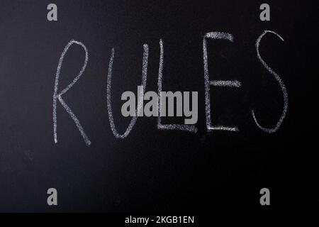 Rules written with chalk Stock Photo - Alamy