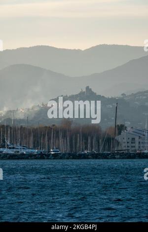 Grimaud a medieval village with a ruined castle and a bell tower at the ...