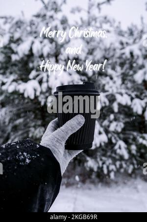 Coffee cup with christmas inscription paper Stock Photo - Alamy