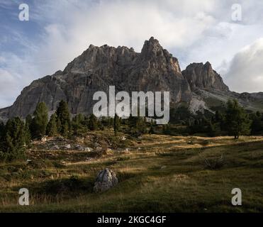 A scenic shot of the Passo Falzarego mountains under the cloudy sky in ...