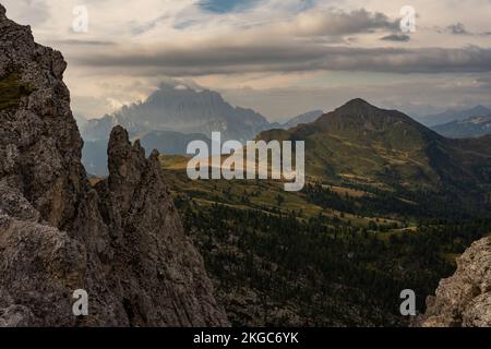 A scenic shot of the Passo Falzarego mountains under the cloudy sky in ...