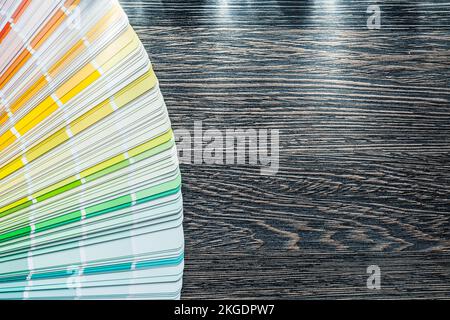 Color sampler fan on wooden board Stock Photo - Alamy