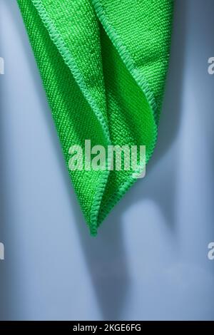 Green kitchen dishwashing cloth on white background Stock Photo - Alamy