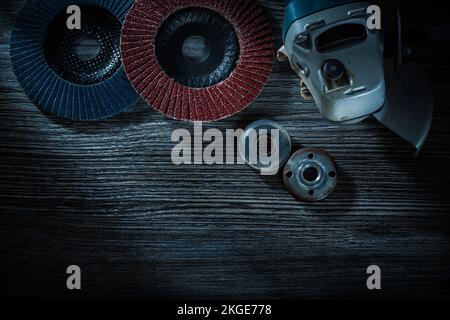 Hand angle grinder rotary grinding discs on vintage wooden board Stock ...