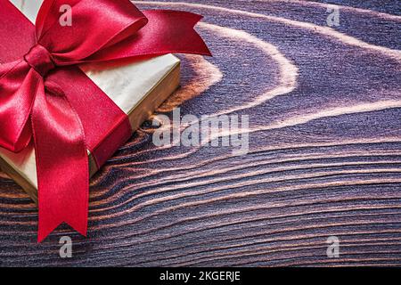 Packed present wrapped in glittery paper on vintage wooden board Stock ...