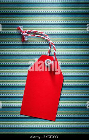 Red price label on striped background Stock Photo - Alamy