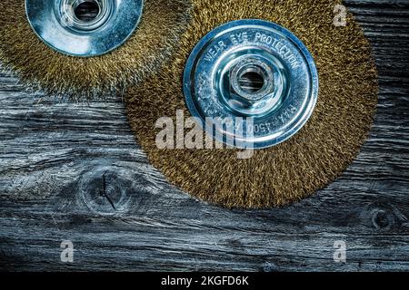 Used wire wheel brushes on vintage wooden board Stock Photo - Alamy