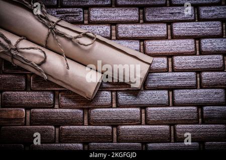 Vintage rolls of paper on wicker wooden background Stock Photo - Alamy