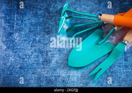 Weeding scoop hand spade rake gardening hoe on metallic background ...