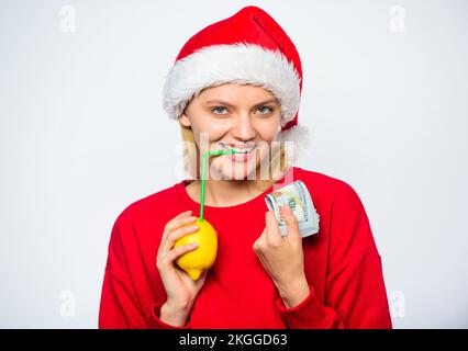 Girl with lemon and money. Lemon money concept. Girl santa hat drink ...