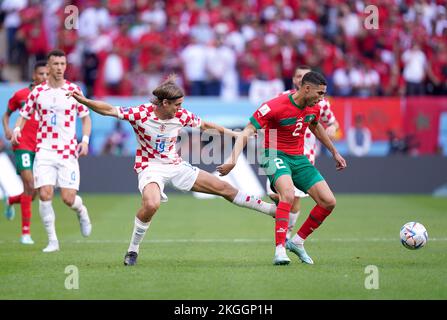 Morocco's Achraf Hakimi (right) and Croatia’s Borna Sosa battle for the ...