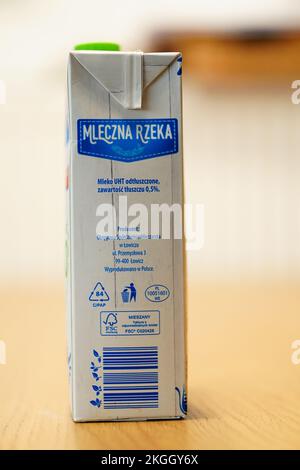 A vertical shot of Polish Mleczna Rzeka brand milk with half percent ...