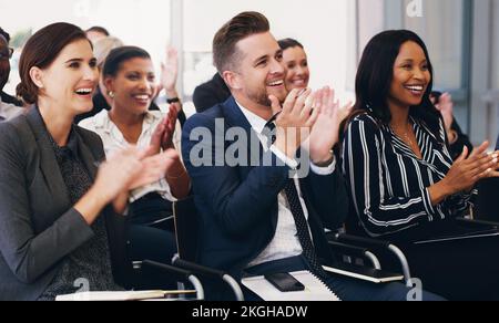 Audience, applause and staff with celebration, corporate training and ...