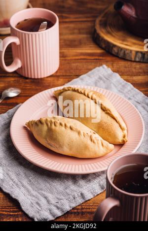 Two Cabbage Hand Pies on Plate Stock Photo - Alamy