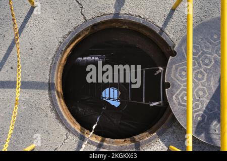 Restricted access manhole cover with Danger, Confined space warning ...
