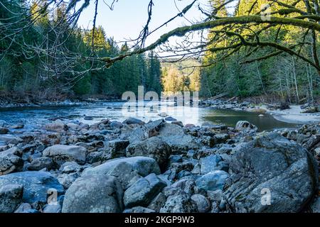 Large rocks line the Snoqaulmie River in Washington State Stock Photo ...