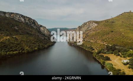 A high-angle of Portas do Rodao natural monument a river with cliffs on ...