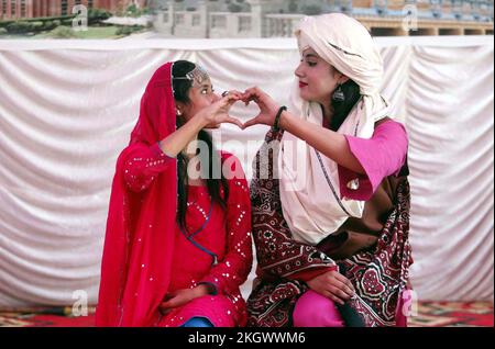 Students are presenting tableaus on stage during a ceremony on the eve ...