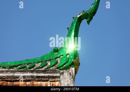 Roof topped with traditional Dok so faa, decorated with bright green ...