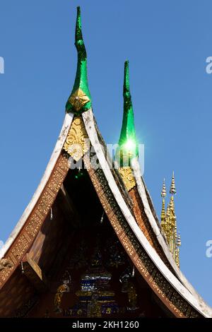 Roof topped with traditional Dok so faa, decorated with bright green ...