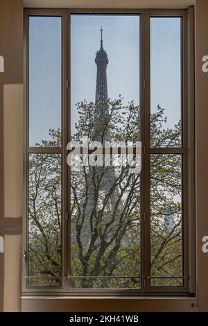 An Eiffel Tower view with the reflection through the glass wall in ...