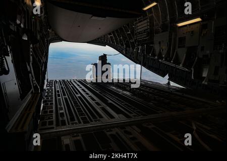 A joint precision airdrop system bundle is deployed from a U.S. Air ...