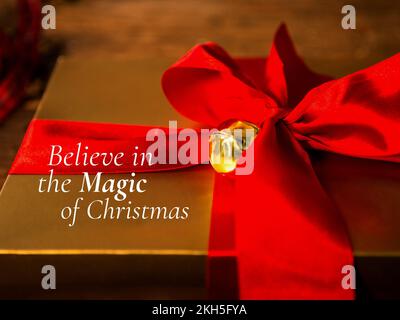 Composite of christmas greetings text over christmas decoration on red ...