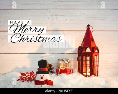 Composite of christmas greetings text over christmas decoration on red ...