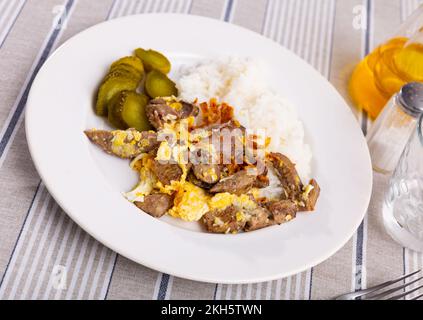 Fried omelette with rabbit liver, boiled rice and pickled cucumber ...