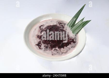 black sticky rice porridge in a bowl. bubur ketan hitam Stock Photo - Alamy