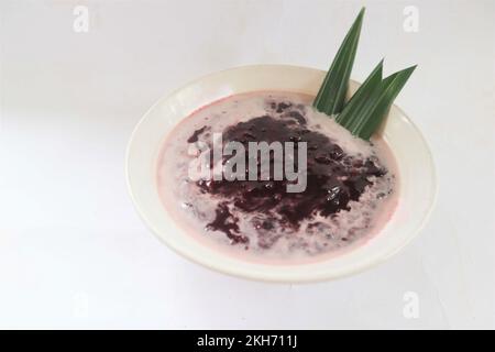 black sticky rice porridge in a bowl. bubur ketan hitam Stock Photo - Alamy