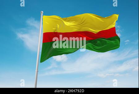 official flag of Humacao untied states of America at cloudy sky ...