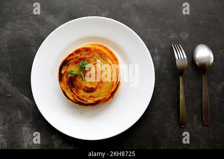 paratha bread or canai bread or roti maryam, favorite breakfast dish ...