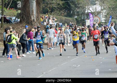 Crowd cheering, spectator support, athletes running race, 95th Comrades ...