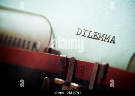 Dilemma word written with a typewriter Stock Photo - Alamy