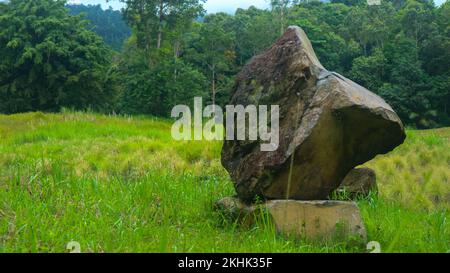 arranged stones piled in a beautiful green grass Stock Photo - Alamy