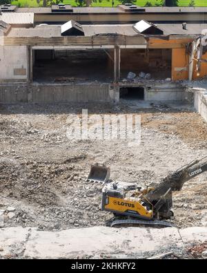 An excavator tearing down a bus garage in Stockholm Stock Photo - Alamy