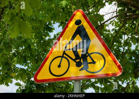Triangle bicycle sign transit prohibited for bicycles on blurred park ...