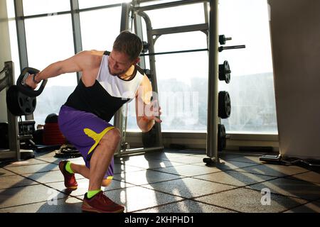Handsome Athletic Men Exercising With Kettlebell in the gym Stock Photo ...