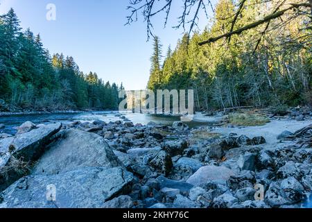 Large rocks line the Snoqaulmie River in Washington State Stock Photo ...