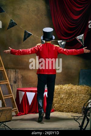 Back view. Illusionist or showman. Young man retro circus entertainer ...